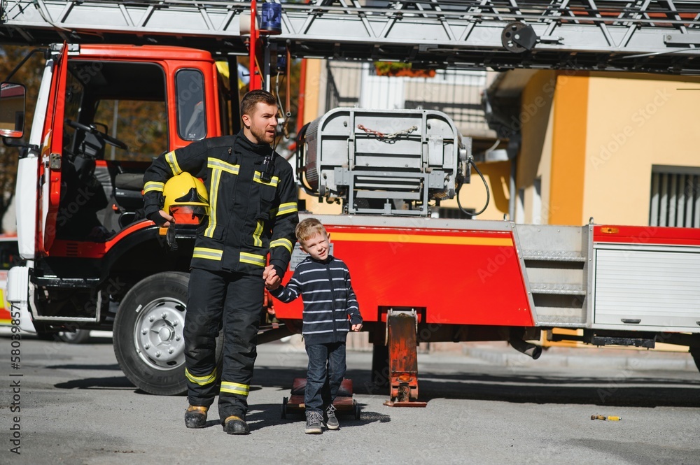 Firefighter holding child boy to save him in fire and smoke,Firemen ...