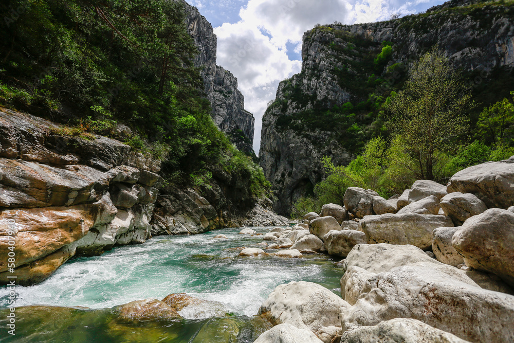 Big mountain river in the middle of valley between narrow canyon walls ...