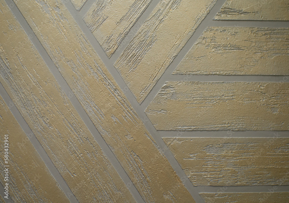 Combination of different strips of decorative golden plaster on the ...