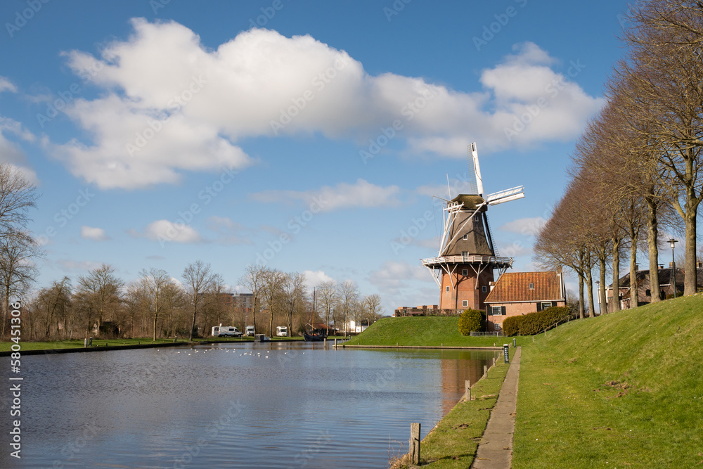 Baantjegracht canal waterway with stage windmill Zeldenrust in town ...