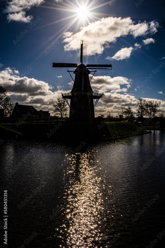 midday silhouette of iconic tower stage windmill Zeldenrust in town ...