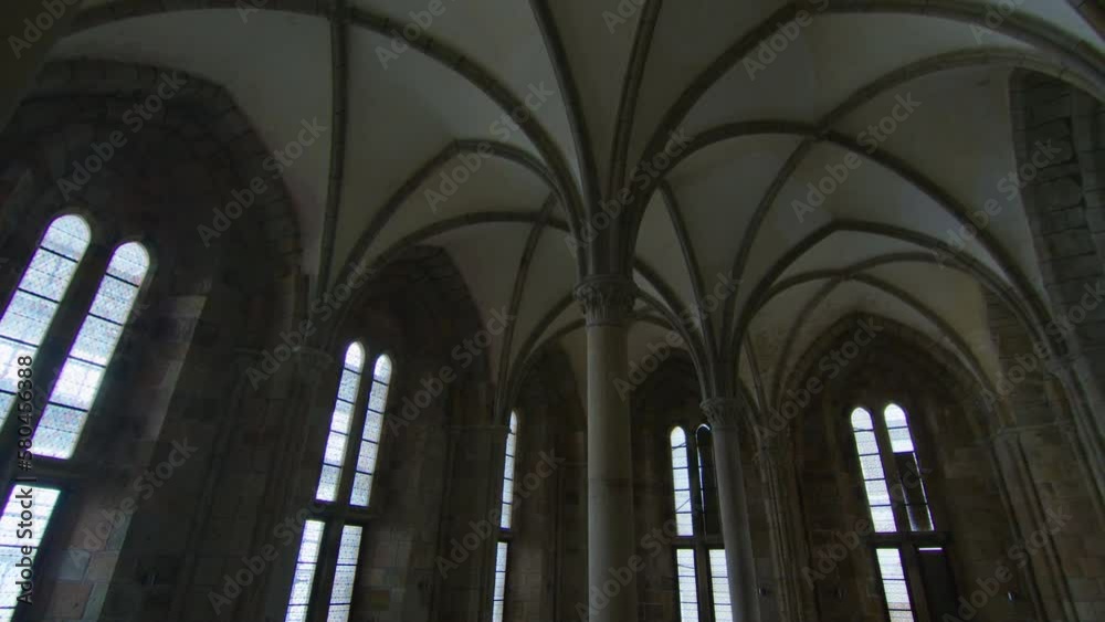 The camera moves inside the church, which is located on top of the Mont ...