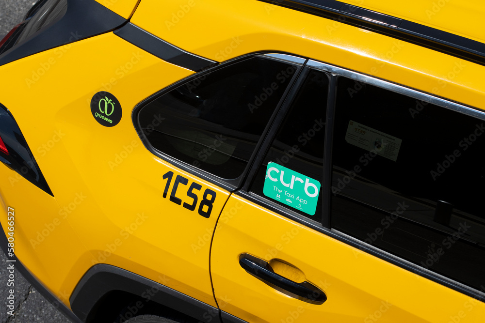 New York, NY, USA - July 5, 2022: Curb taxi app sticker is seen on the ...