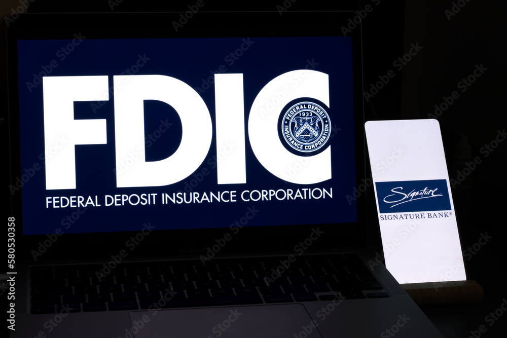 Smartphone with Signature Bank logo on background of FDIC ( Federal ...