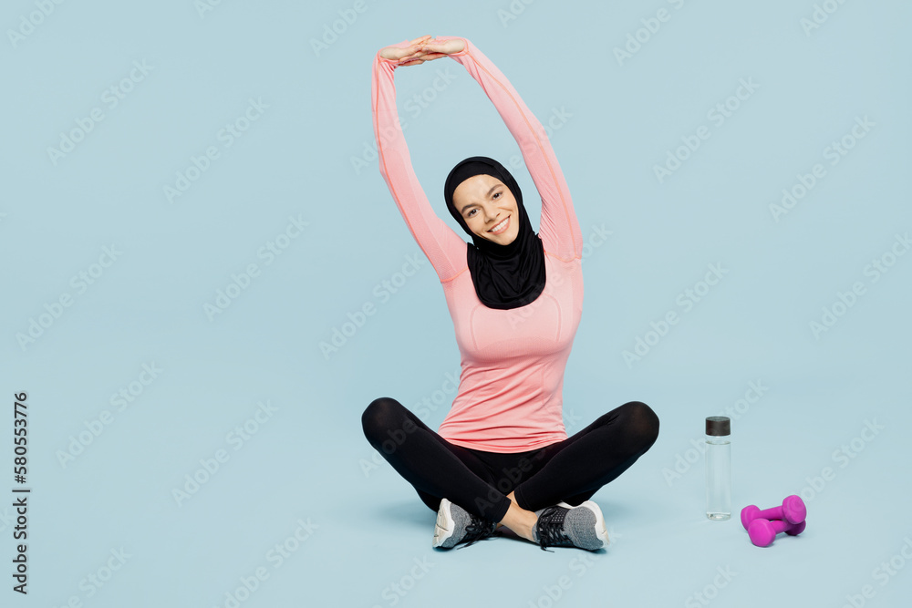 Full body young muslim fitness trainer sporty woman wear pink abaya ...