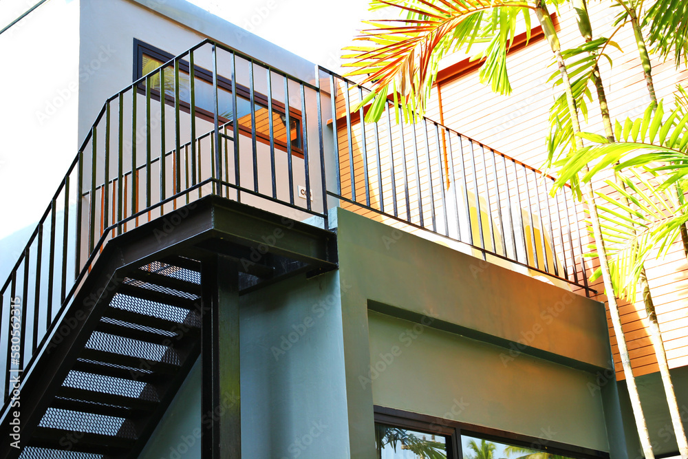 black metal stairs and fence to second floor in resort building Stock ...