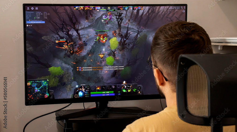 IRPEN, UKRAINE, JUNE 12 20222, Man behind a computer plays Dota 2 ...