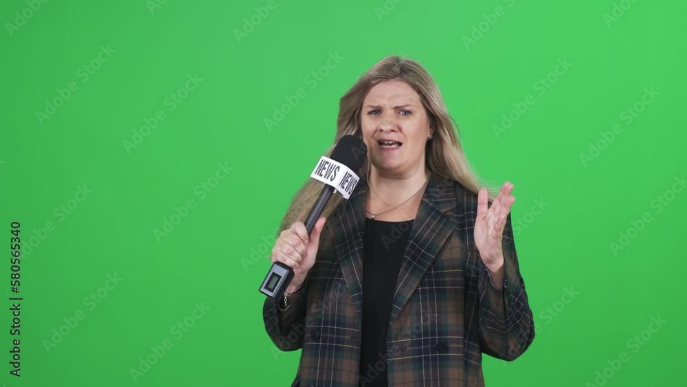 Windy weather, woman in suit looks into the camera and speaks into a ...