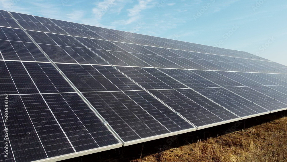 Solar power plant. Flight over modules of solar power station on sunny ...