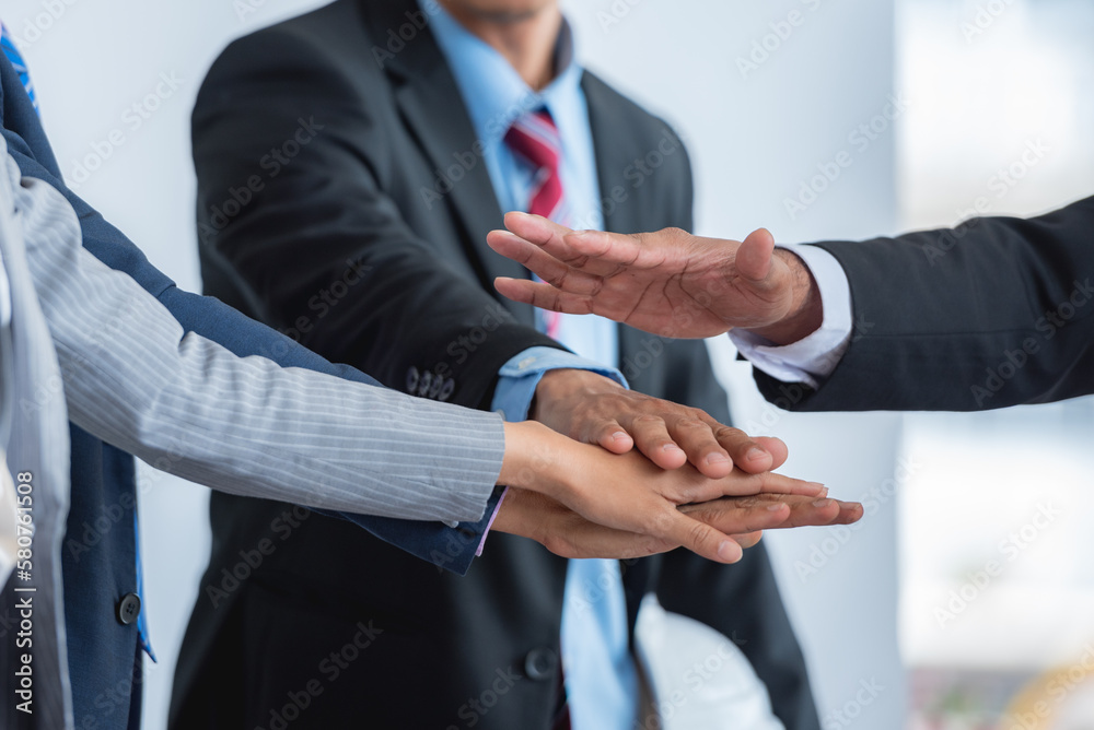business teamwork putting join hands together. Unity and teamwork show ...