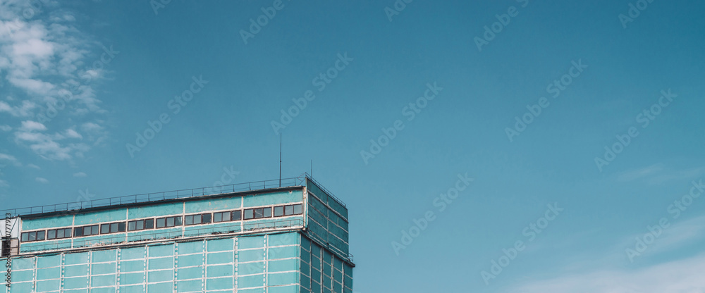 Giant wall of multistory production building. Picturesque old renovated ...