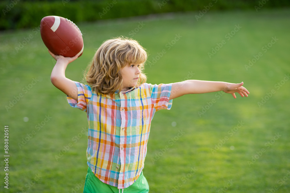 Foto de Portrait of child with rugby ball. American football, rugby ...