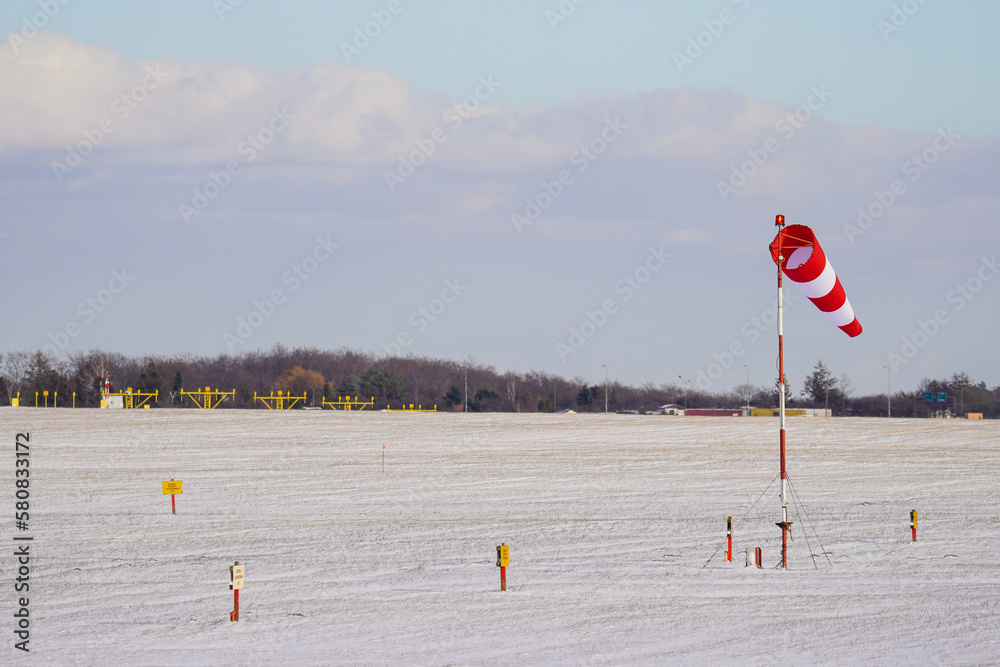 Windsock indicator of wind on runway airport. Wind cone indicating wind ...