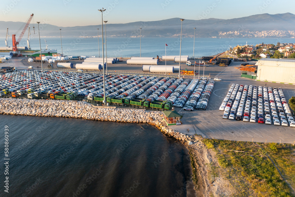 New assorted cars lined up in the port waiting to be loaded on the ro ...
