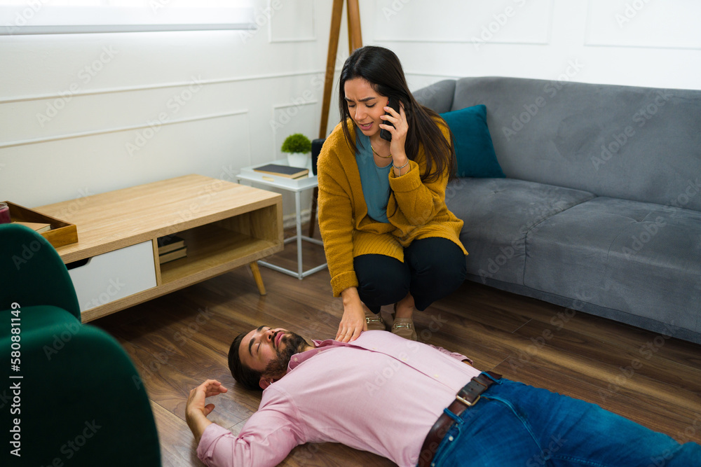 Sick man fainting and scared woman calling for help Stock Photo | Adobe ...
