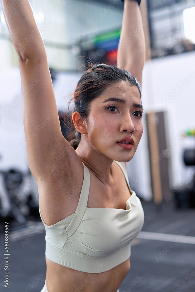 Beautiful Strong Woman take the deep breathing after Doing Pull Ups bar ...