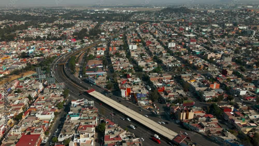 Vidéo Stock Overhead view of mexican suburban area with multi-lane road ...