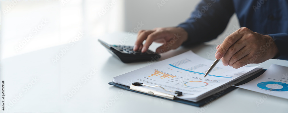 copy space of young businessman accounting analyzing using calculator ...
