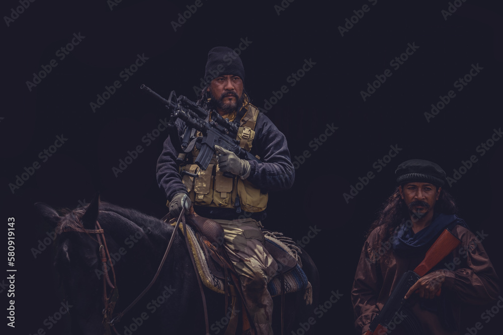man in military outfit warrior Mujahedin,riding horse with hand holding ...