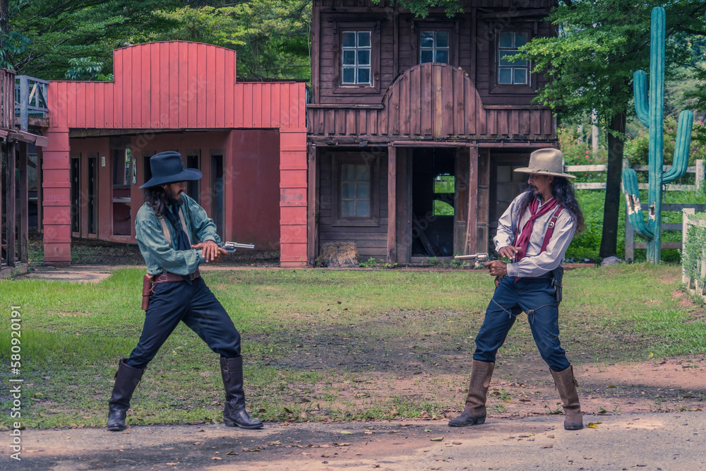 Cowboy.back view of cowboy with gun prepares to gun fight.Conwboy with ...