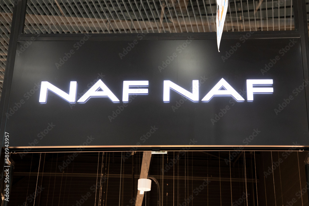 naf naf boutique brand logo and sign text on wall shop facade entrance ...