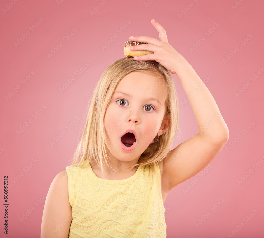 Child, donut and wow face portrait in studio with hand on head on a ...