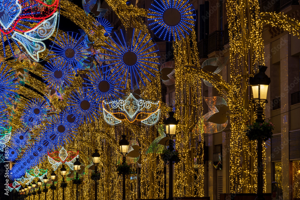 Carnival mask decoration along street in Spain with festive street ...