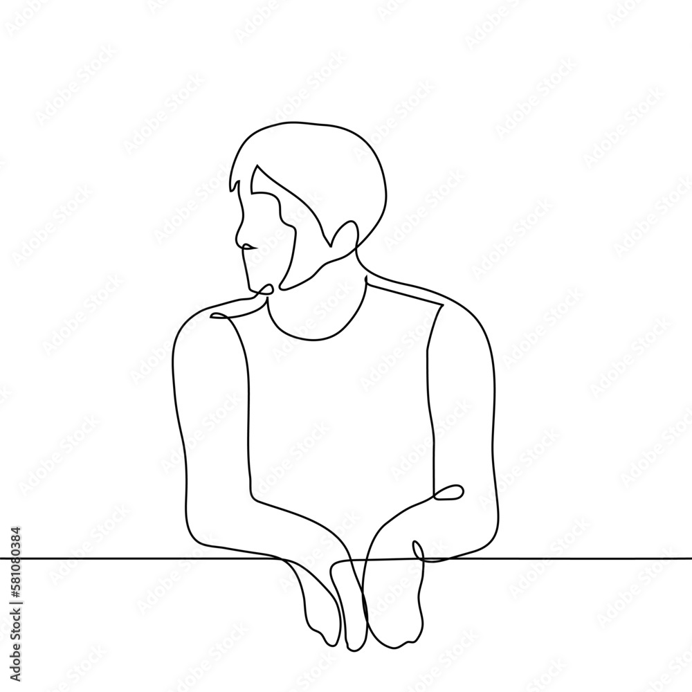 man looks into the distance leaning his elbows on the railing - one ...