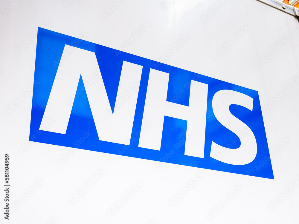 London, UK, March 11th 2023: A NHS logo in blue and white. On a medical ...