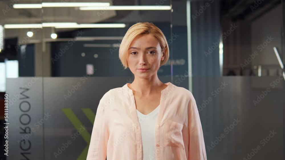 Portrait of a beautiful, confident blonde female freelancer with highly ...