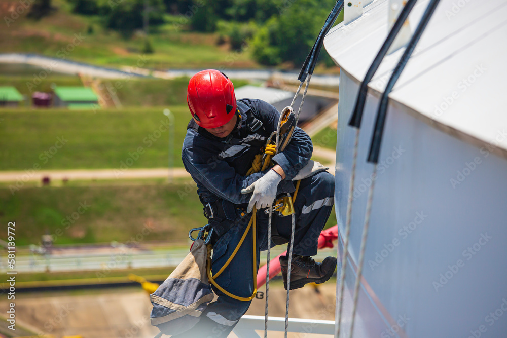Focus male worker inspection wearing safety first harness rope safety ...