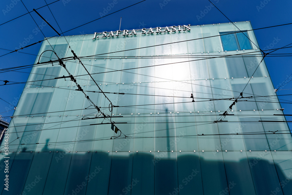 Green glass facade of modern office building of Swiss private bank J ...