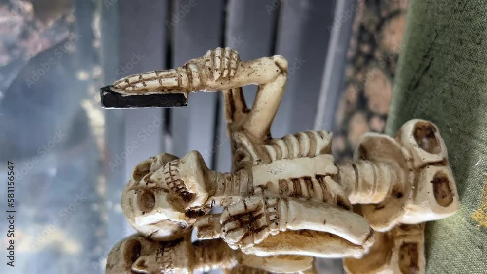 Skeletons without legs take a selfie look at a mobile phone they smile ...