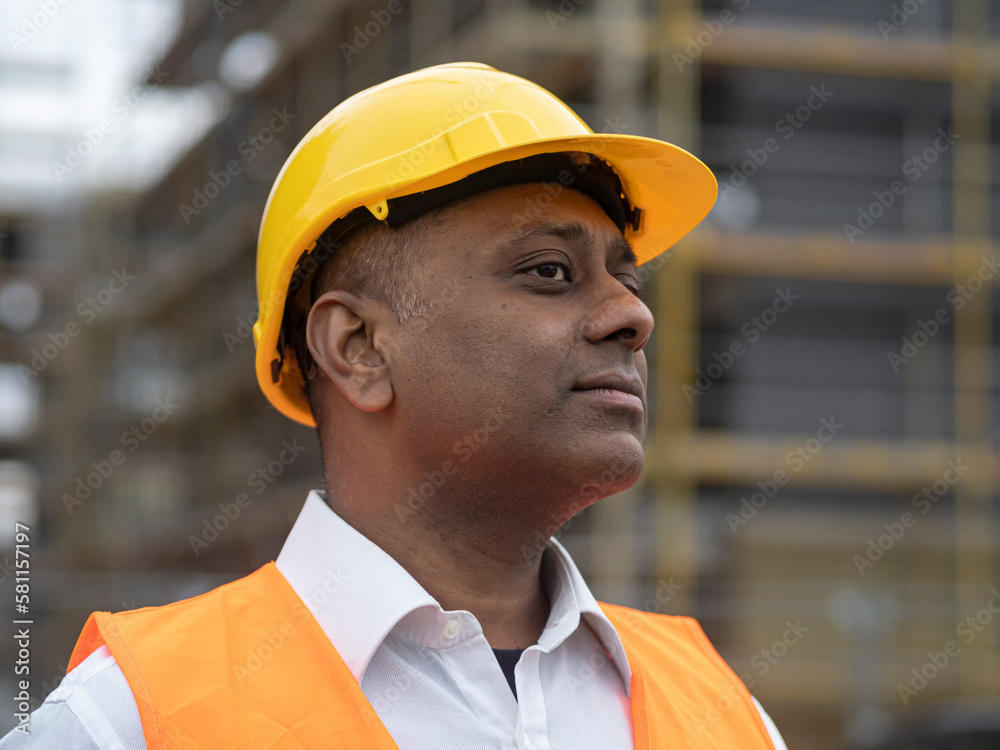 Profile portrait of an absorbed civil engineer or factory worker ...