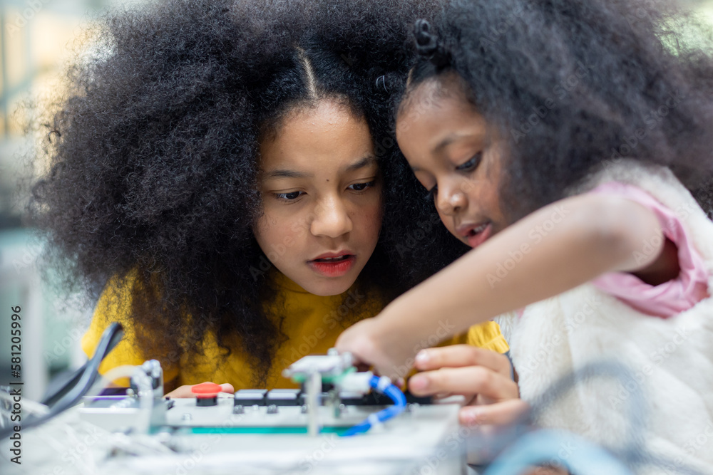 Group Kid teen child enjoy Machine Learning Robot arm is Moving Under ...