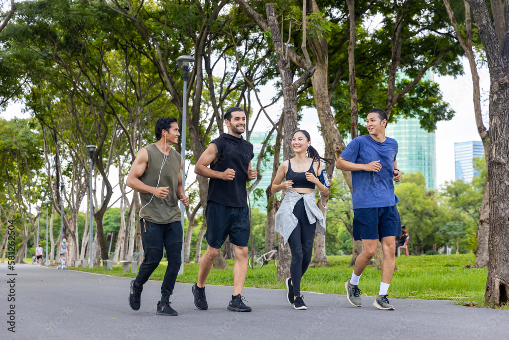 Group of Man and woman friends in sportswear jogging exercise together ...