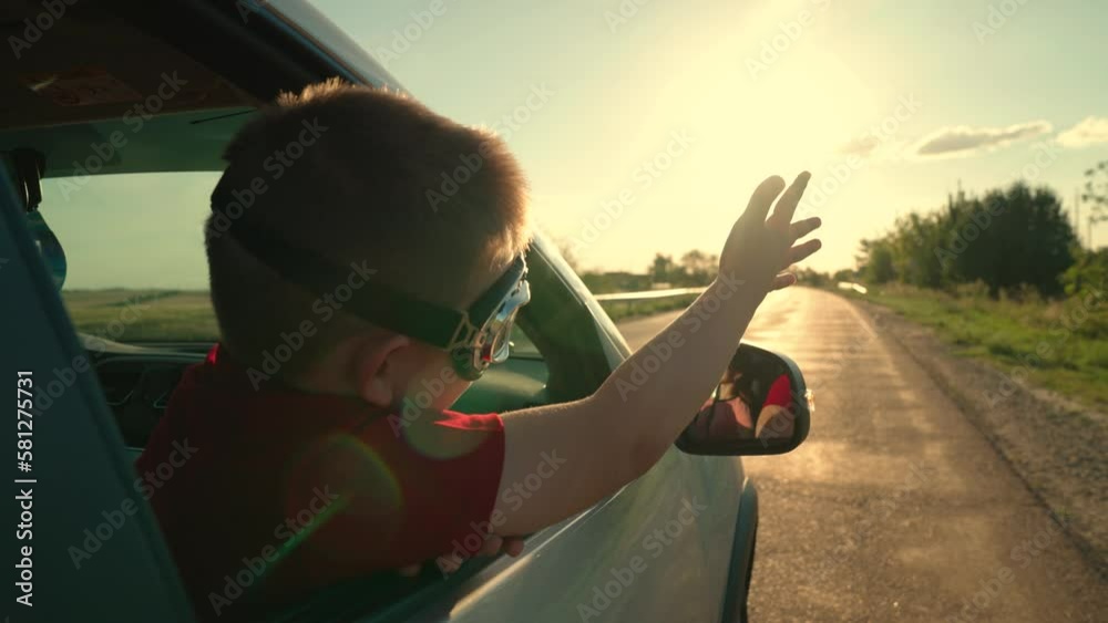 Little boy, kid travels in car. Happy child rides in car, looks out ...