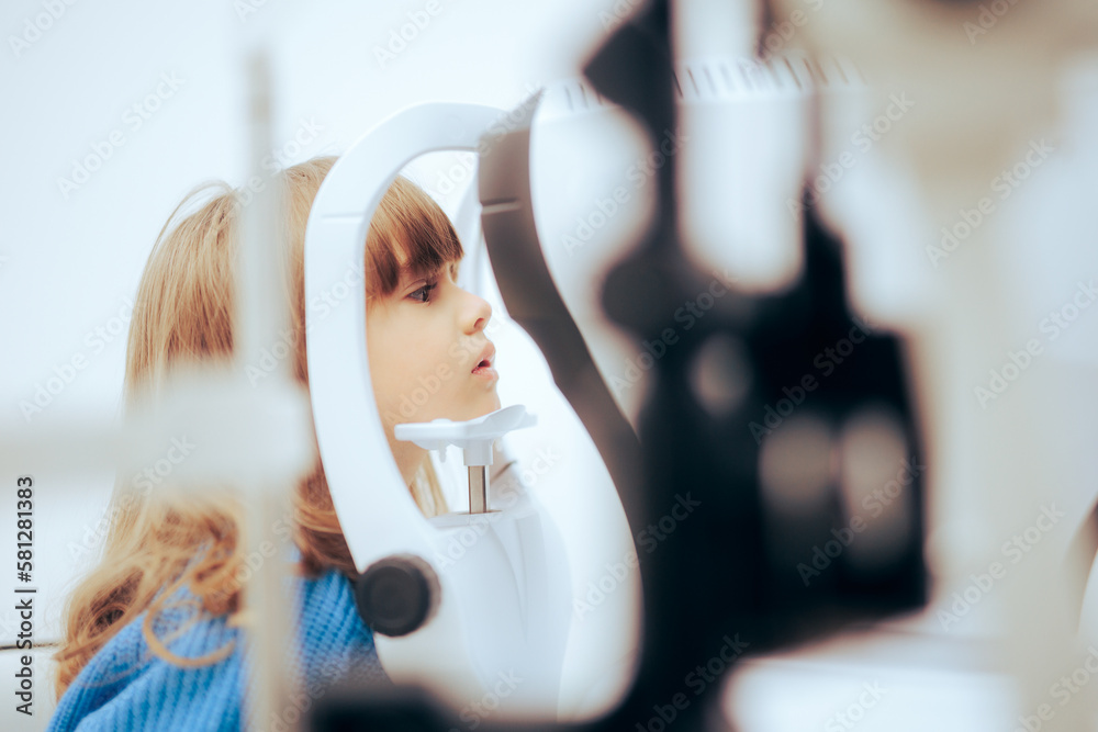 Toddler Girl During Eye Examination with a Slit Lamp Microscope. Little ...