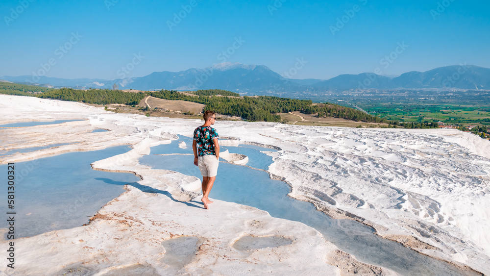 Natural travertine pools and terraces in Pamukkale. Cotton castle in ...