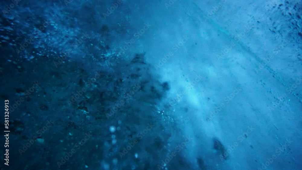 Foto de Turquoise pure color of ice inside the ice cave. Stones and ...