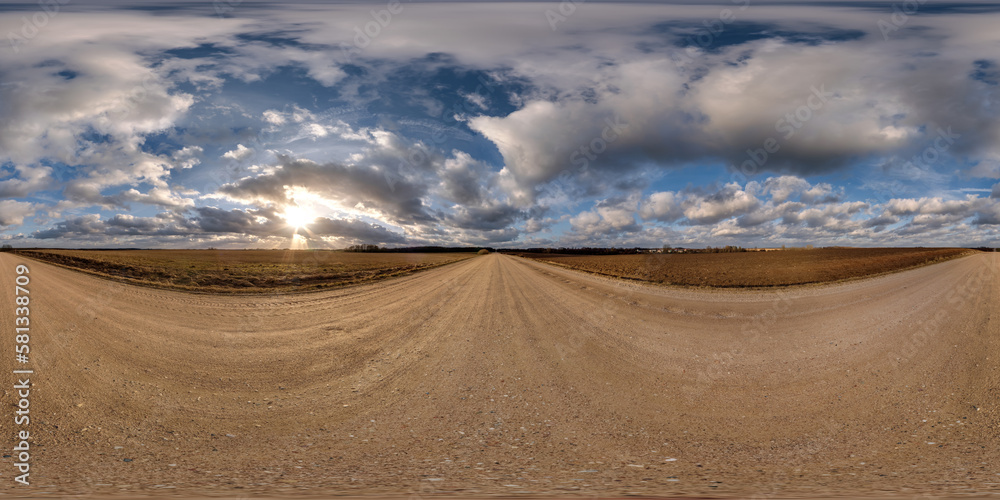 evening 360 hdri panorama on gravel road with clouds on blue sky before ...