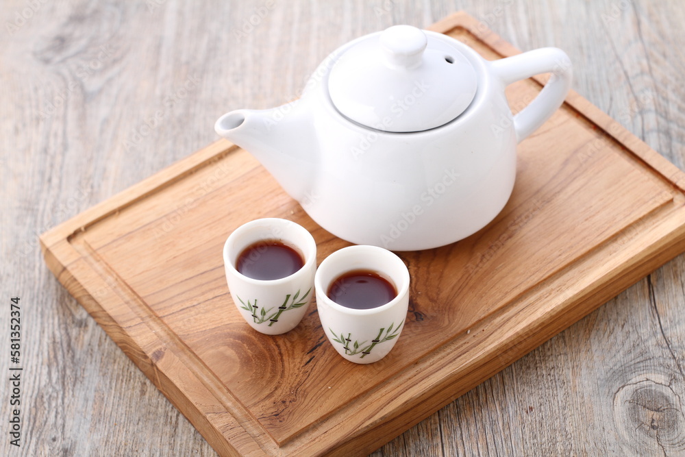 Tea is an aromatic beverage prepared by pouring hot or boiling water ...