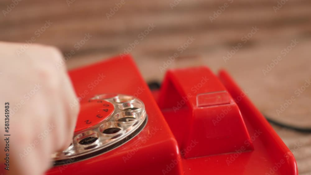 close-up child's hand quickly hysterically dialing 911 on a vintage ...