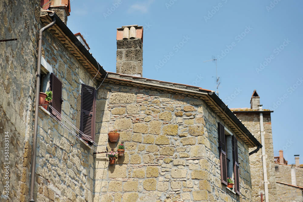 Narrow old streets of the famous Pitigliano town. Beautiful italian ...