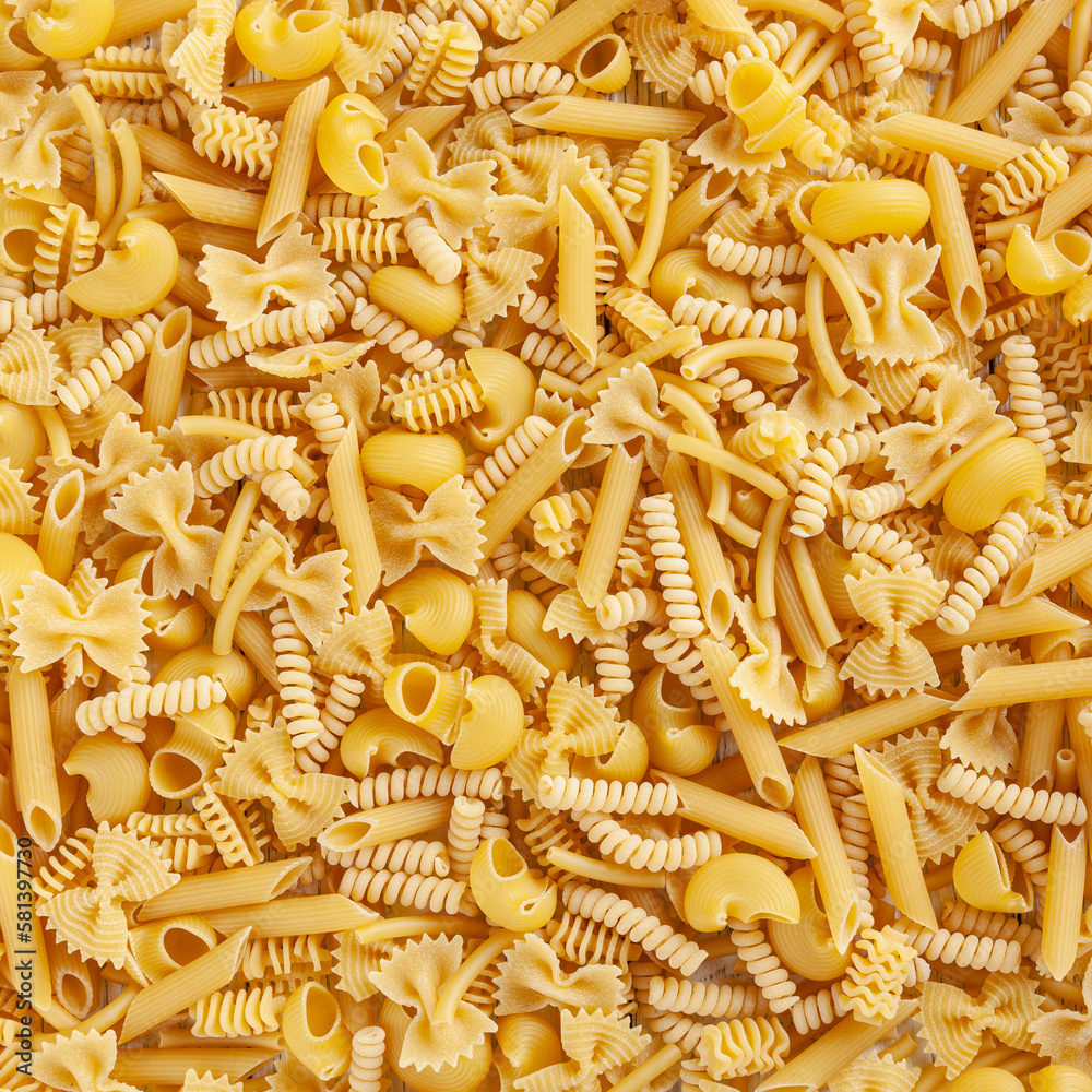 Different types and shapes of Italian pasta background Stock Photo ...
