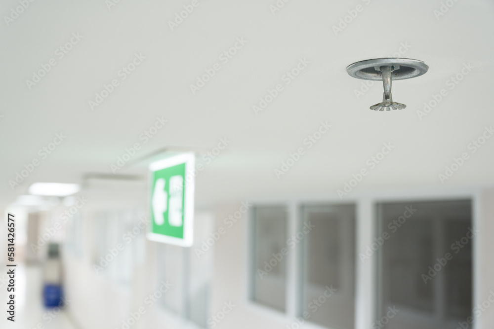 Fire fighting equipment, sprinkler on white ceiling background ...