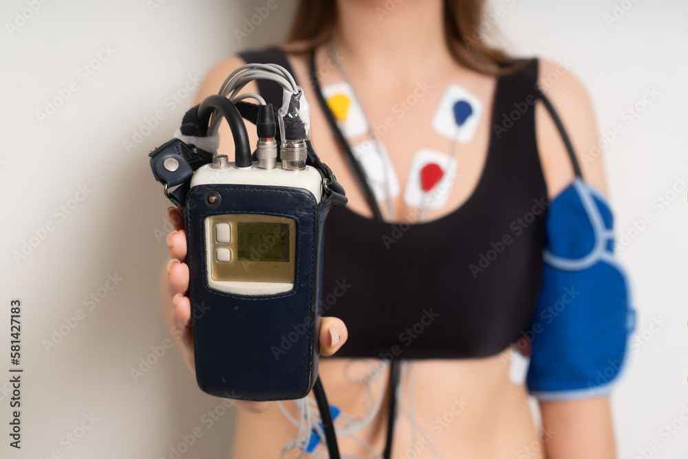 ECG sensors, electrocardiogram and blood pressure measurement. Woman ...