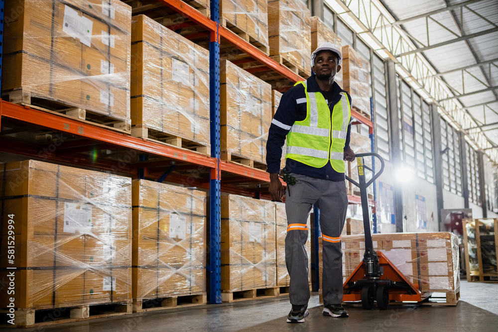 Warehouse industrial stock storage, man worker wear safety uniform push ...
