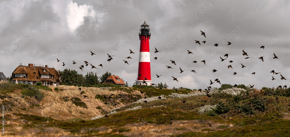 Lighthouse of Hörnum on Sylt island Germany. Red and white tower with ...