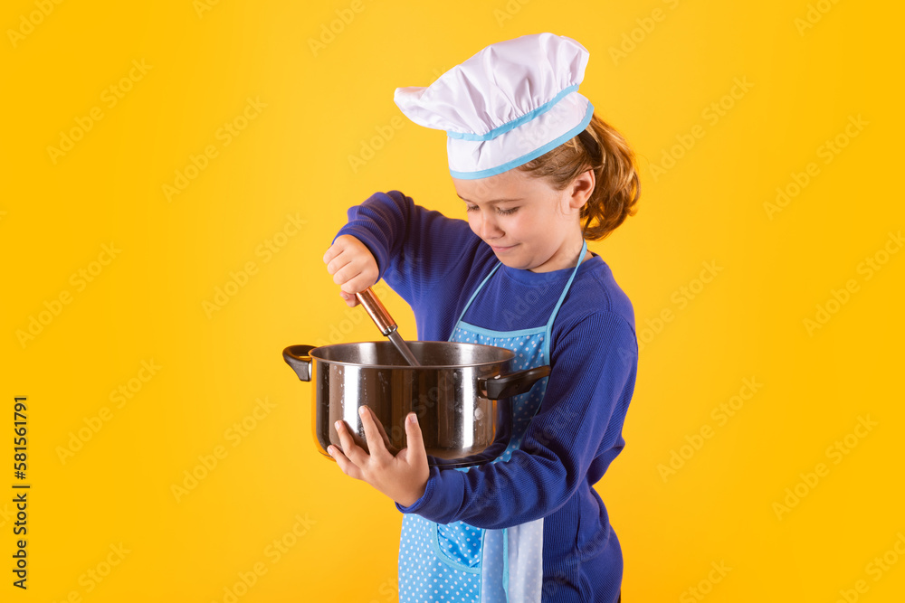 Kid cook with cooking pot and ladle. Chef kid preparing healthy food ...